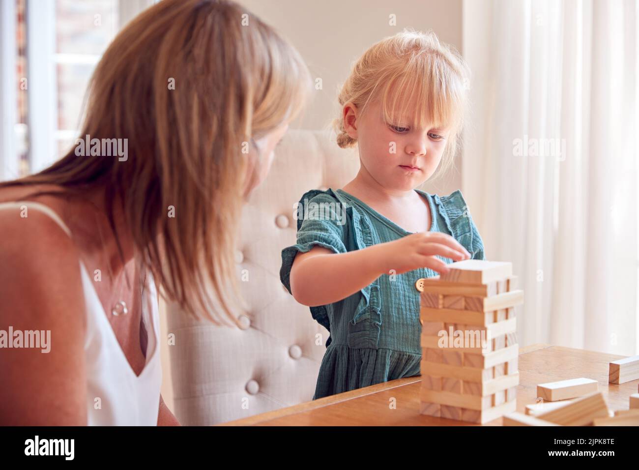 mother, playing, balance, daughter, stacks, concentrated, blocks, mom ...