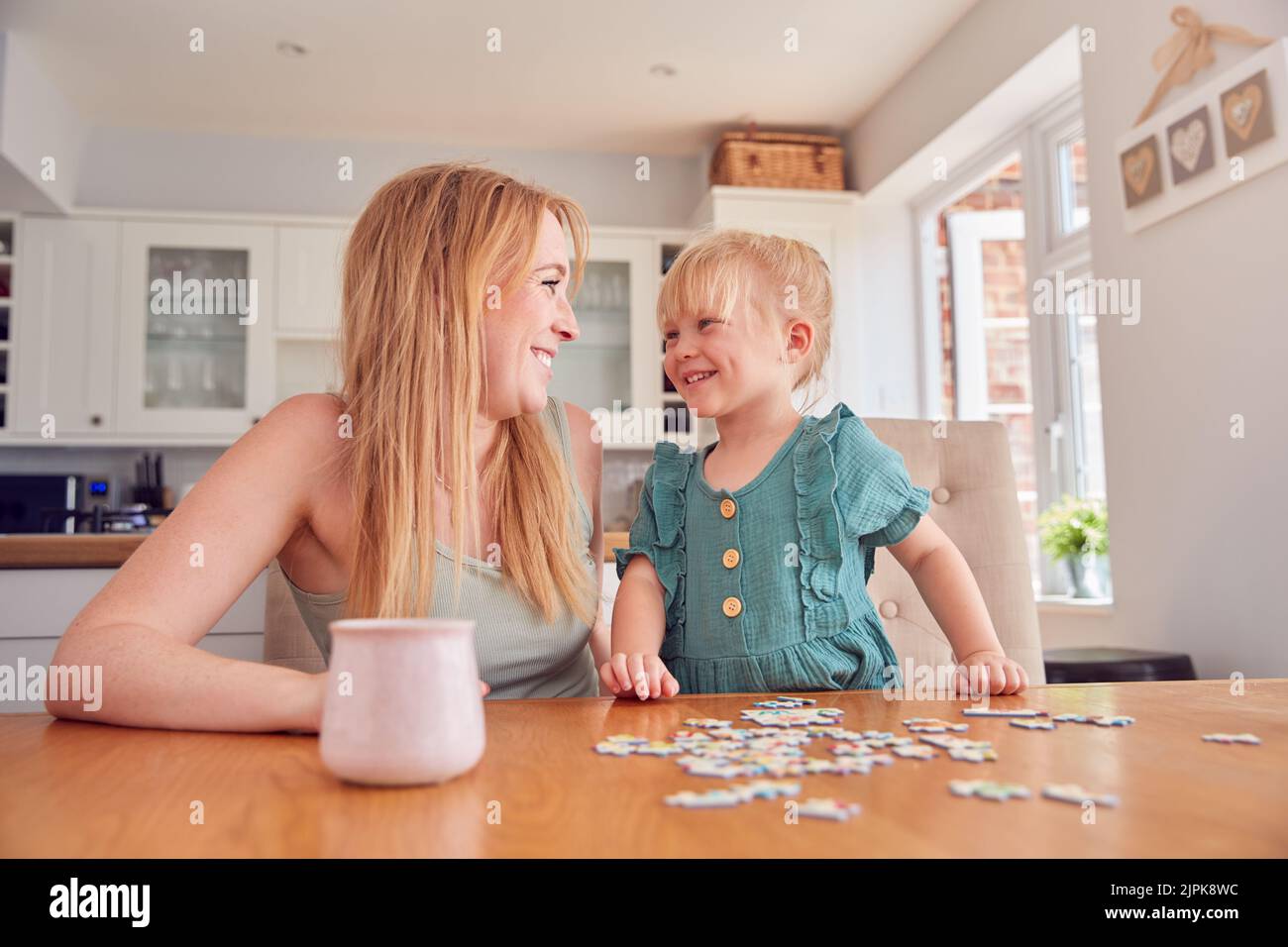 mother, smiling, daughter, jigsaw puzzle, looking at each other, mom ...