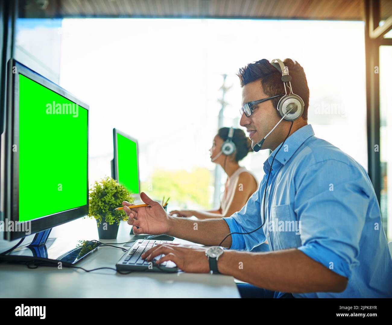 The best team to handle your queries. a young man and woman using ...