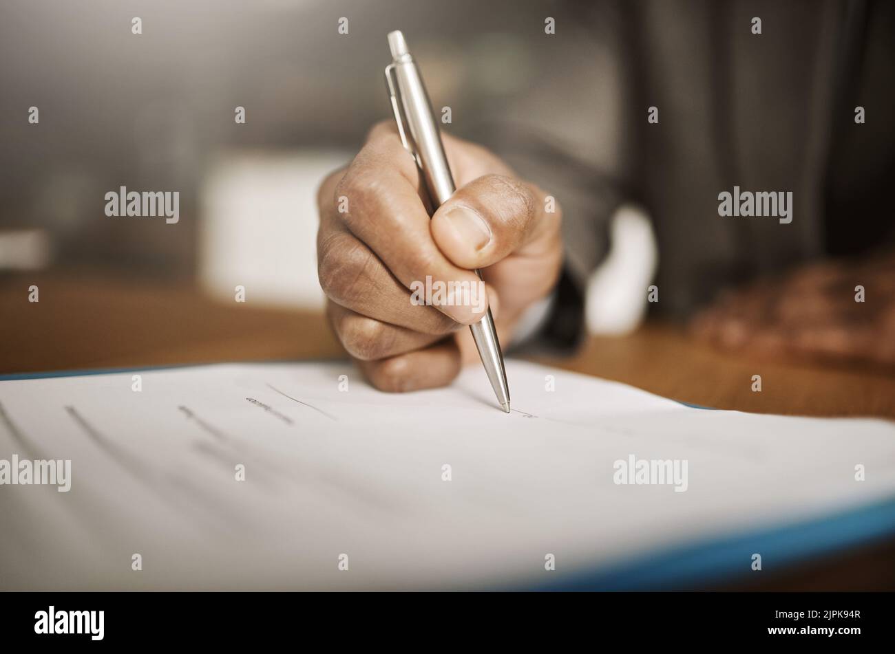 This is the first step. an unrecognizable businessperson signing papers ...