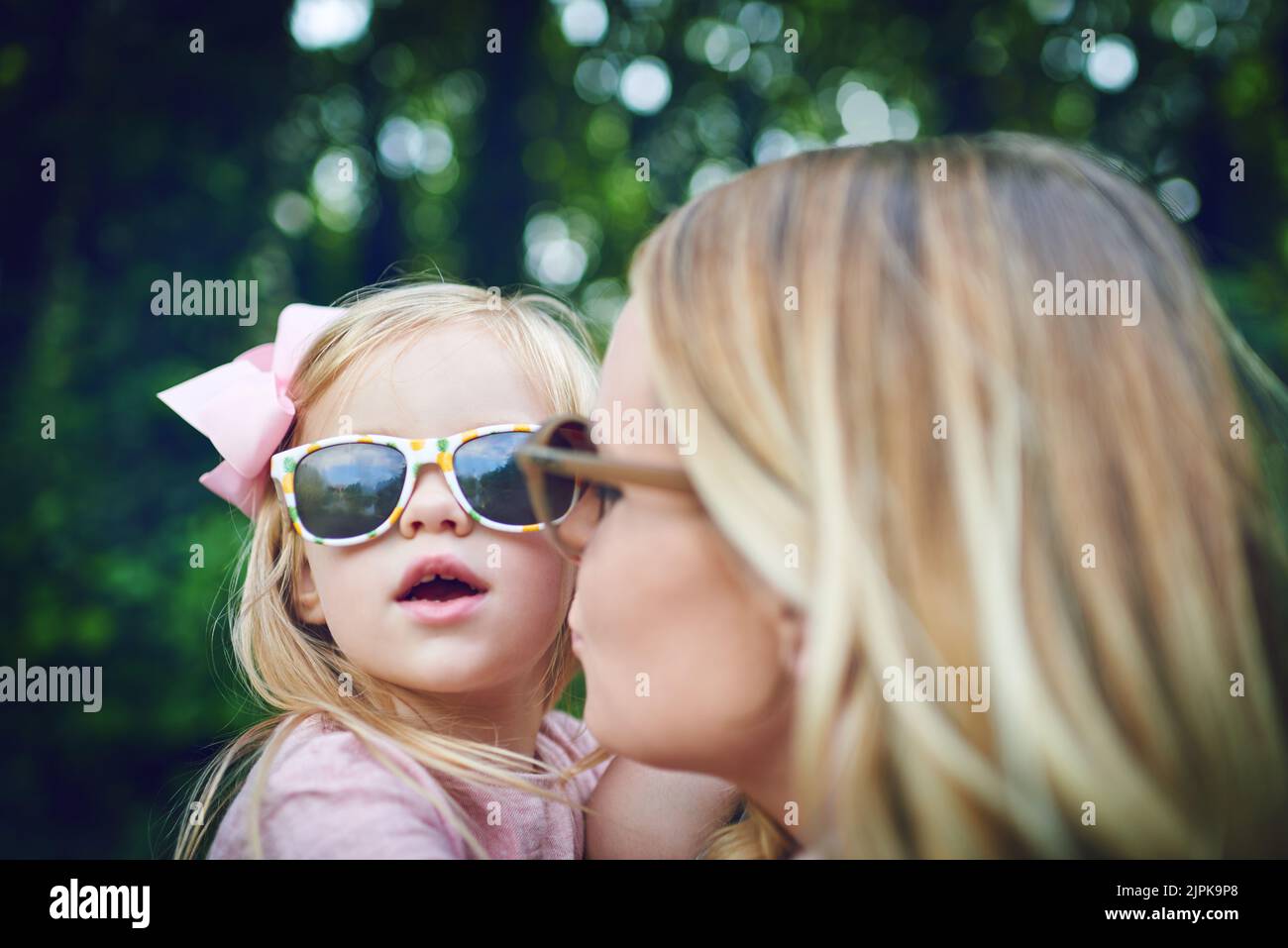 Little girls love being outdoors. an adorable little girl bonding with ...