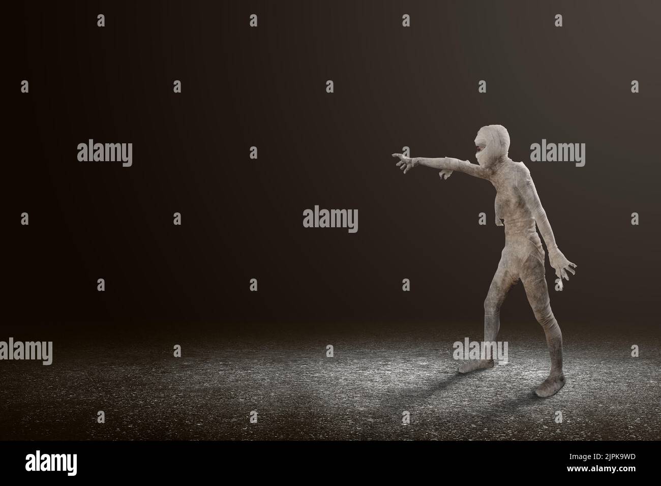 Mummy standing with claw hands with a dark background. Halloween ...