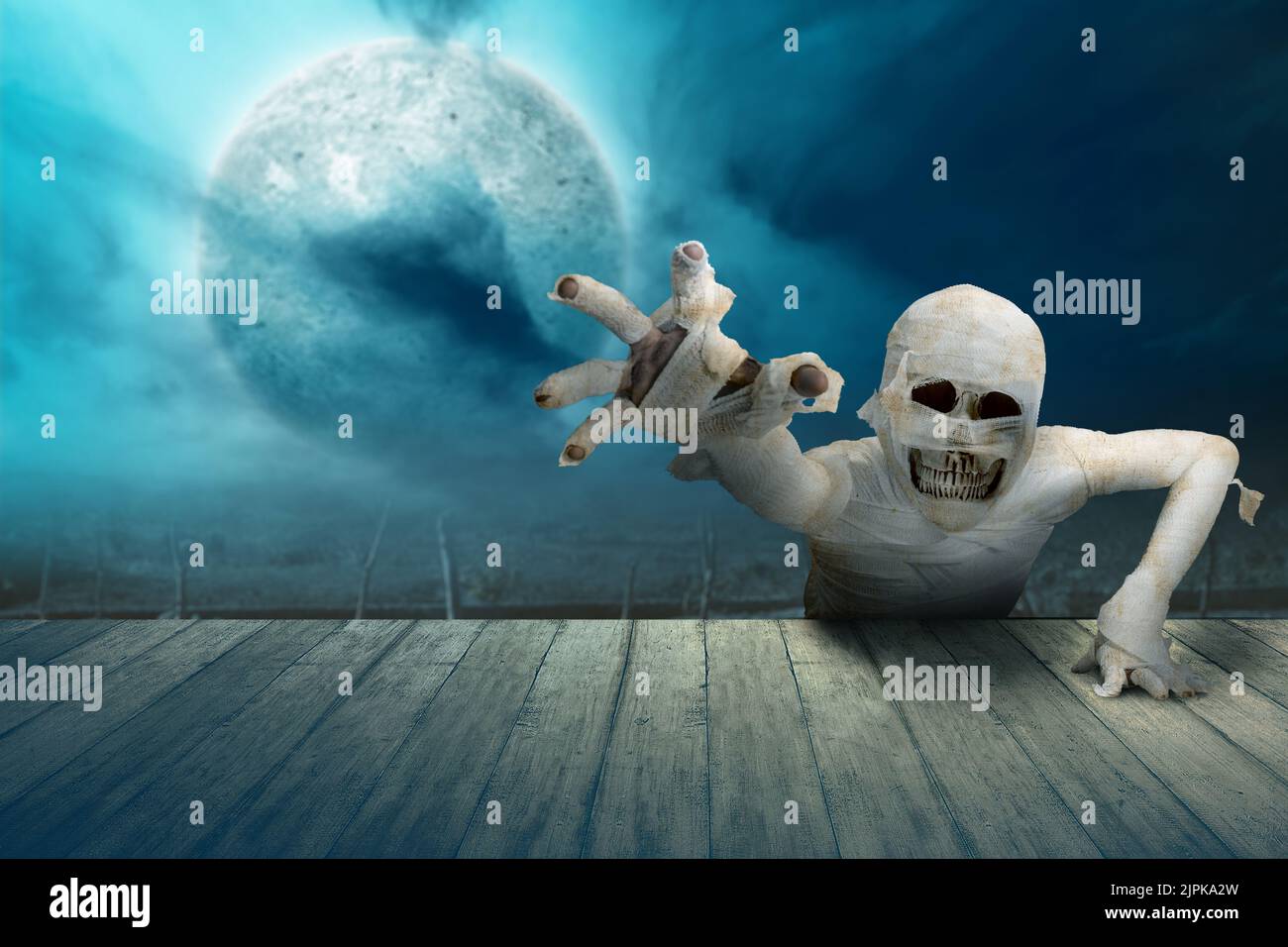 Mummy with skull head crawling with a night scene background. Halloween ...