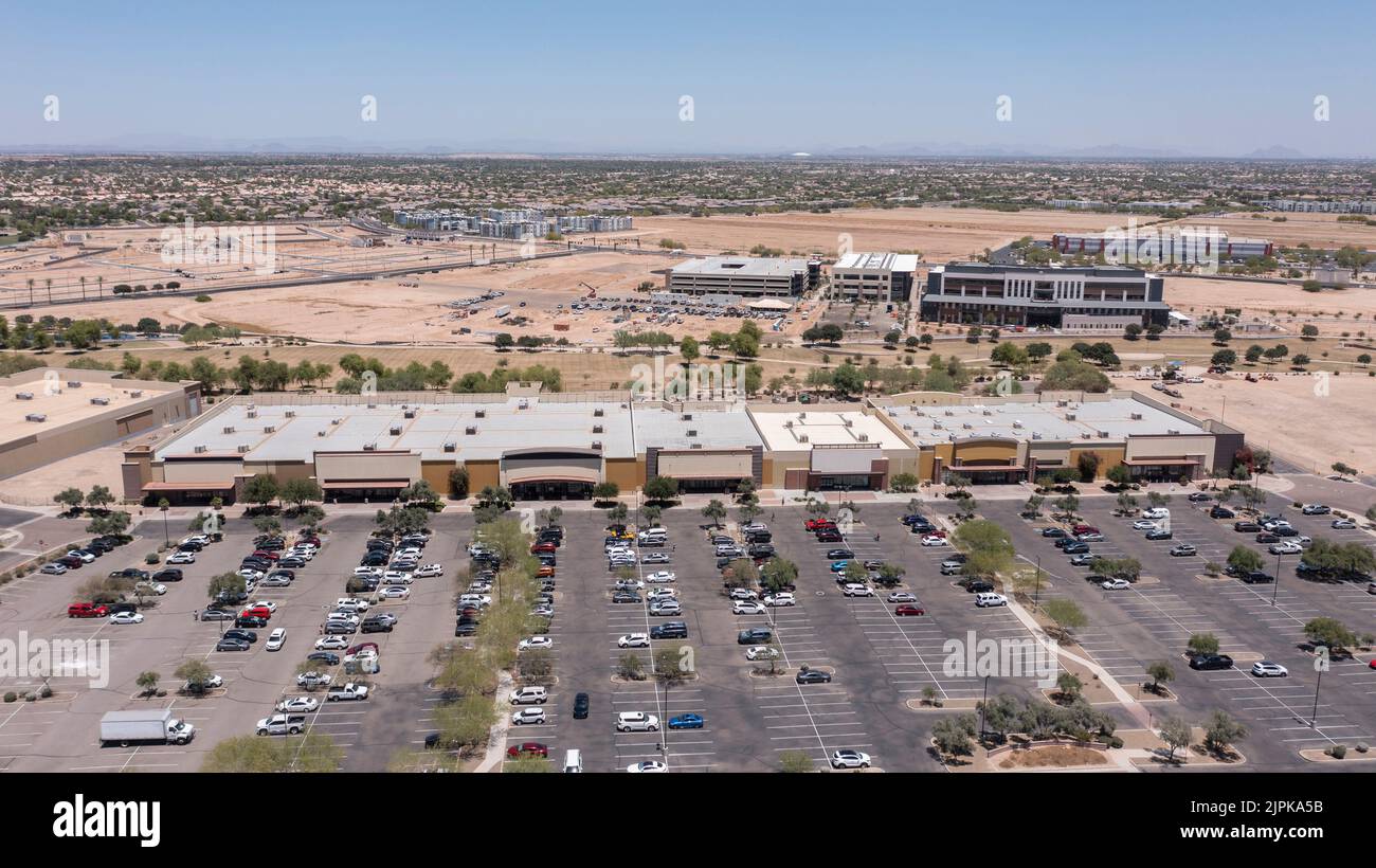 Afternoon aerial view of new shopping mall sprawl and empty lots of ...