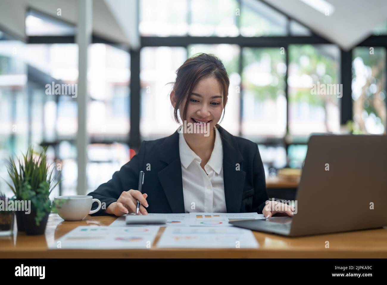 Business woman accountant calculate business report and marketing data ...