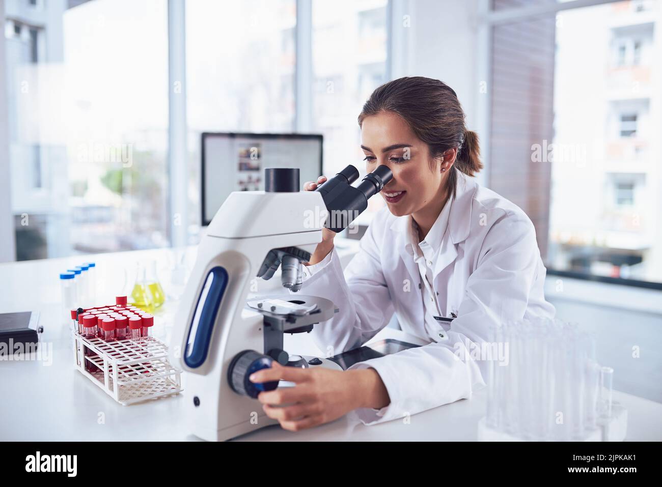 She stumbles across new findings everyday. a cheerful young female ...