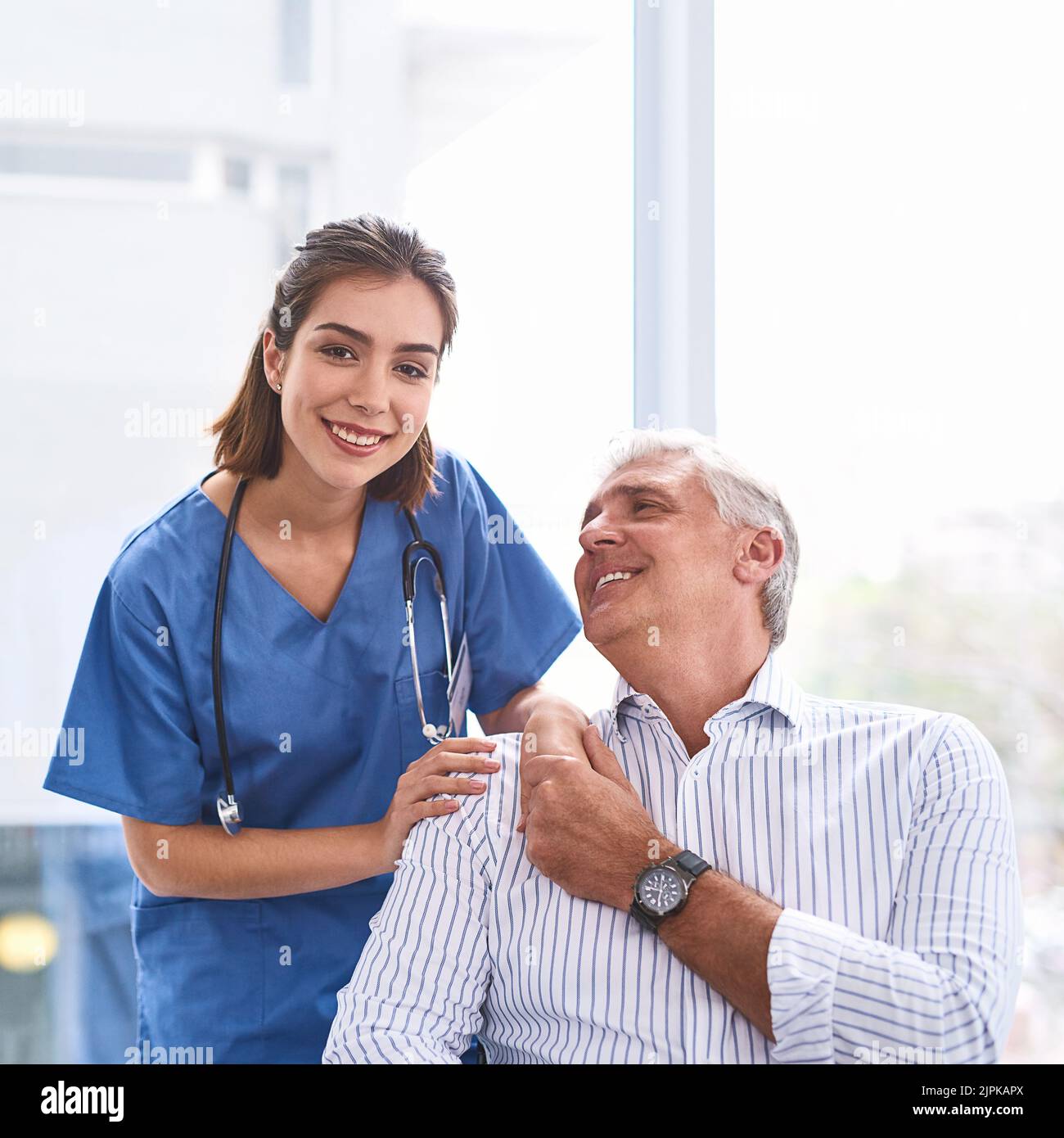 We take real care of our patients. Portrait of a cheerful young female ...