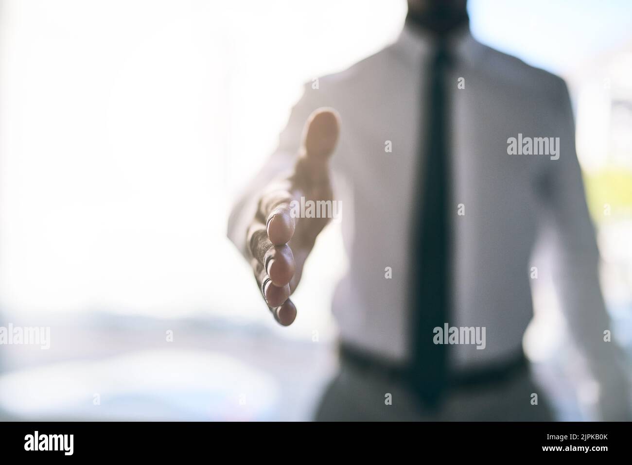 Good day to you sir. a unrecognizable business person stretching out ...