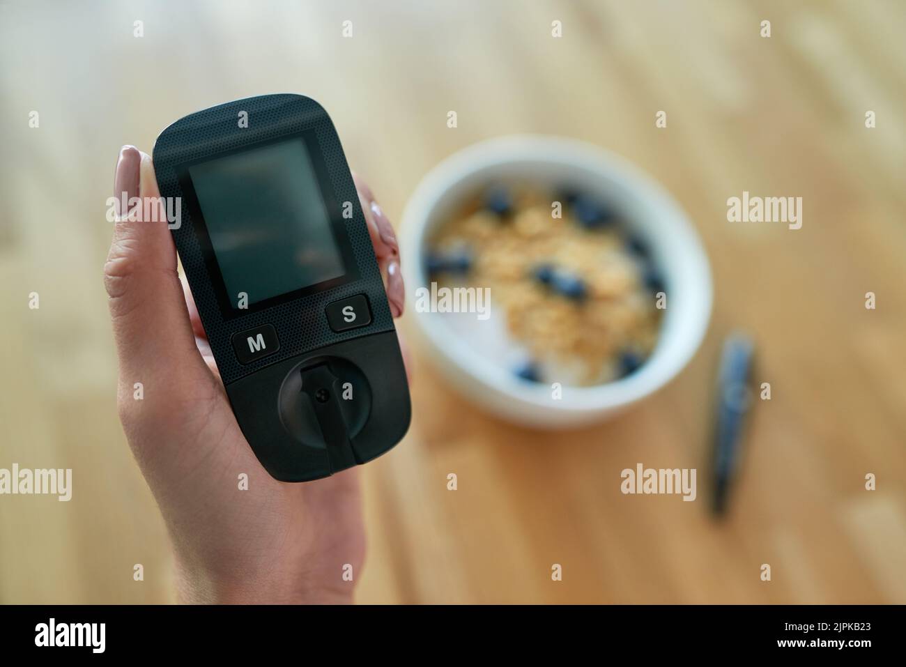 Measuring her blood sugar levels. Closeup shot of an unrecognizable ...