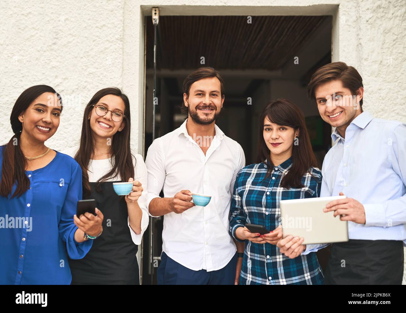 Meeting outside of the office. Portrait of a cheerful creative business ...