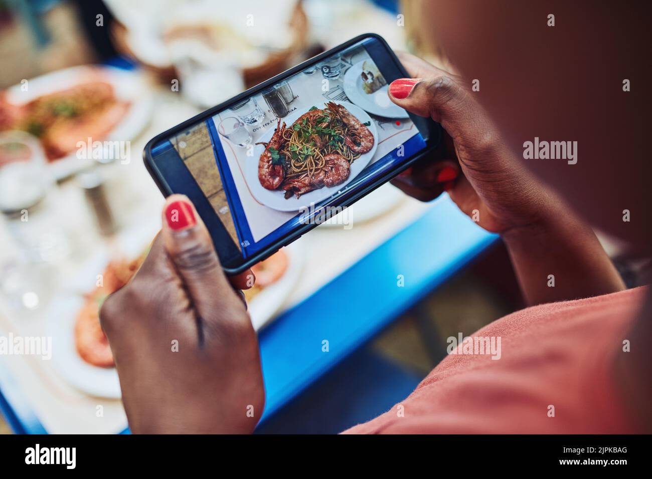 Get a taste of the place youre visiting. a woman taking a picture of ...