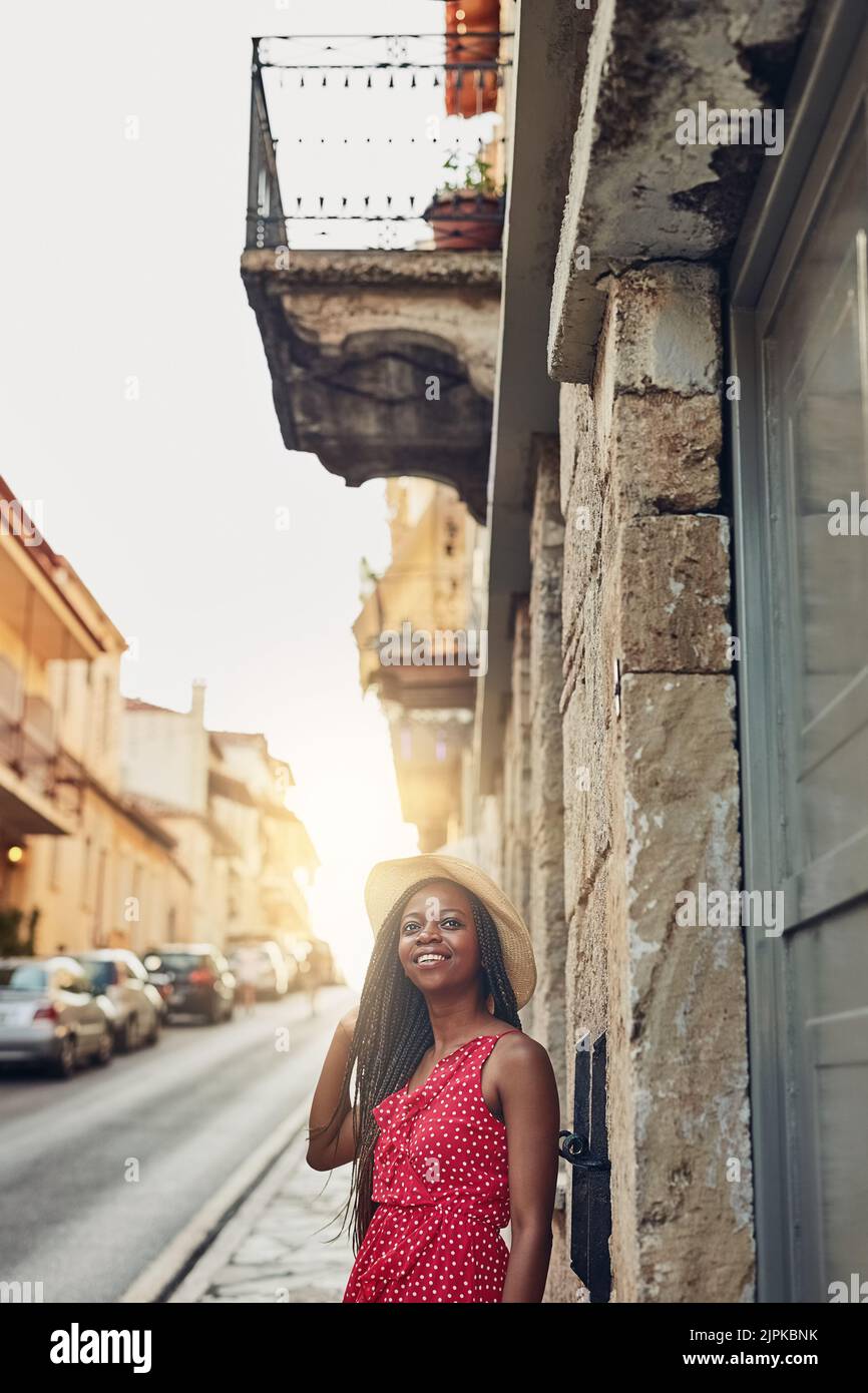Travel with an open mind. a beautiful young woman spending her day out ...