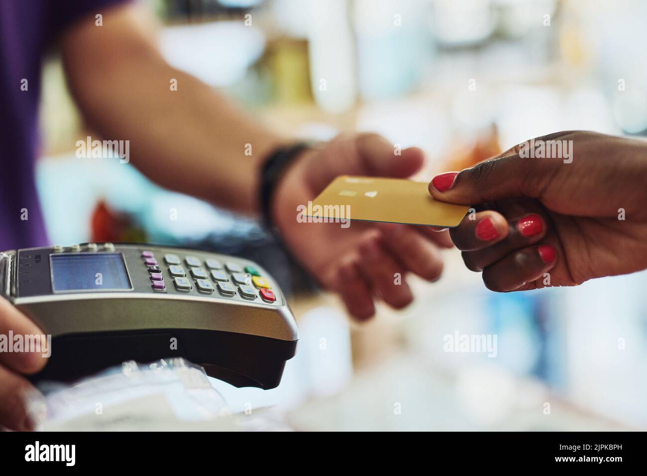 We accept all forms of payment. an unrecognizable customer making ...