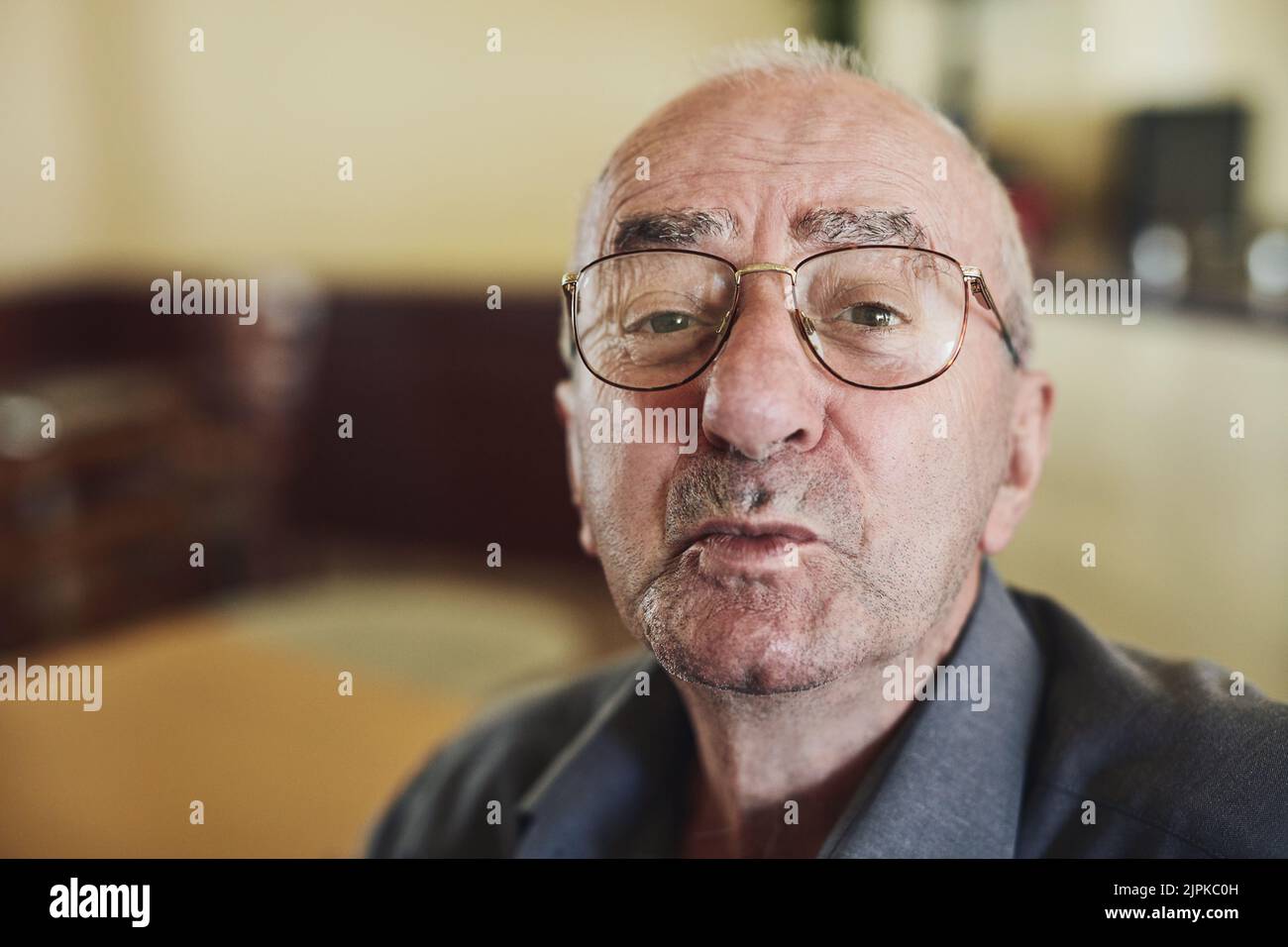 Retirement is sweet. a senior man in an old age home Stock Photo - Alamy
