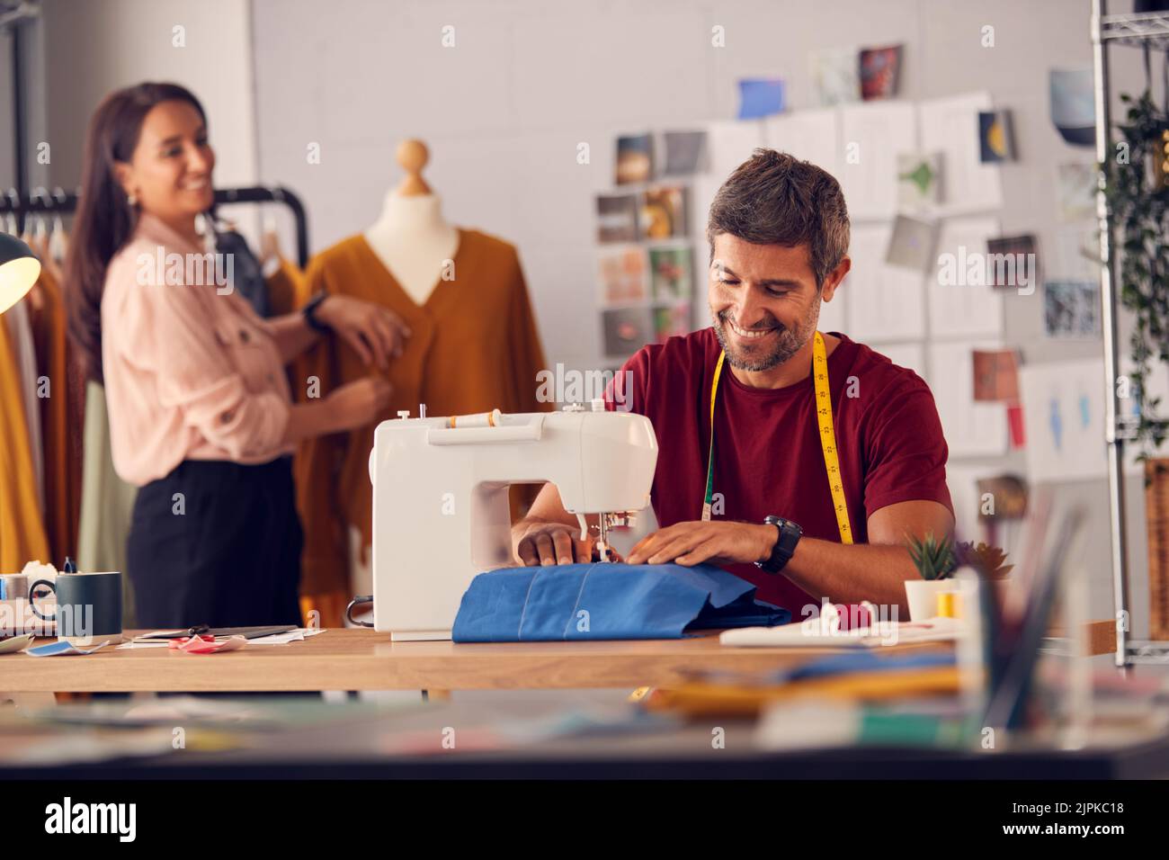 Lady sewing with baby hi-res stock photography and images - Alamy