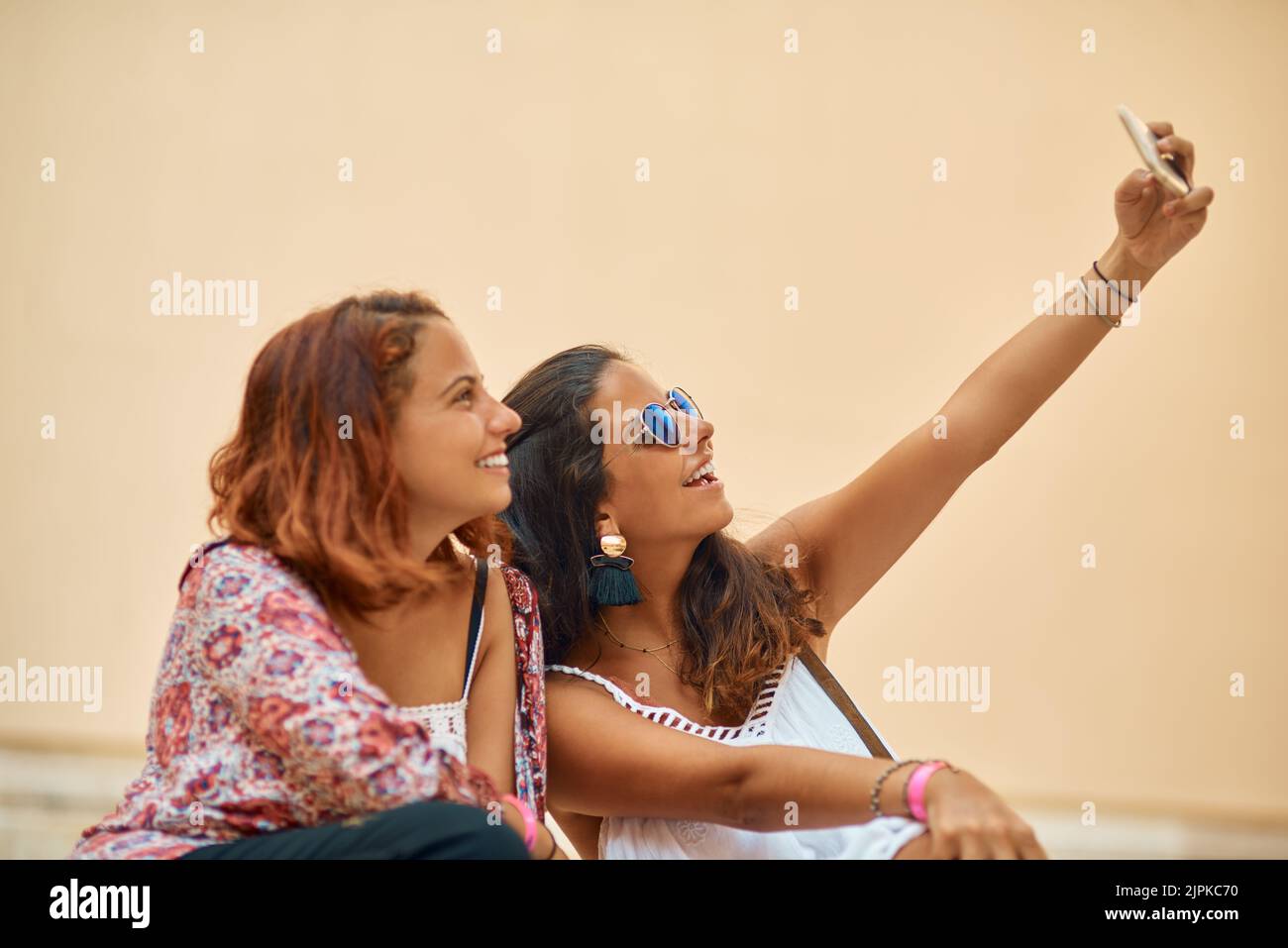 Two attractive female traveler taking hi-res stock photography and ...
