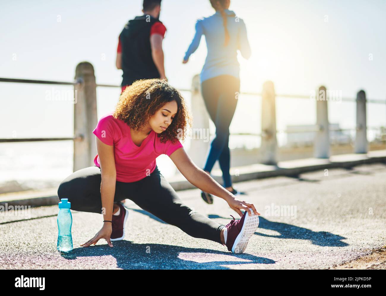 Getting amped and ready for a great run. a sporty young woman doing ...
