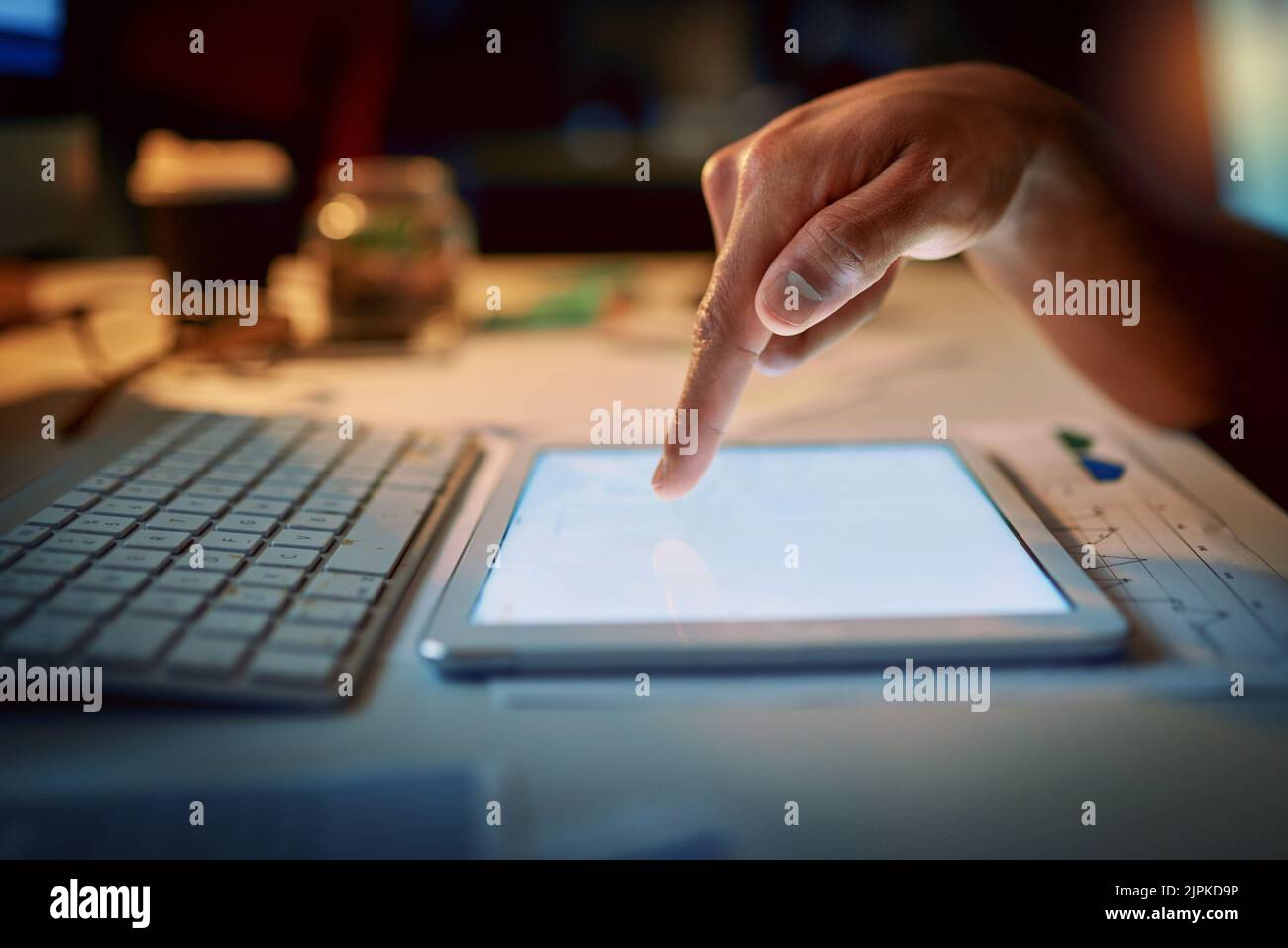 Business at the tap of an icon. an unrecognizable man using a digital ...