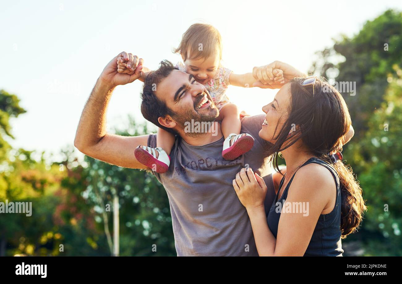 We always enjoy family bonding time. a young family outdoors Stock ...
