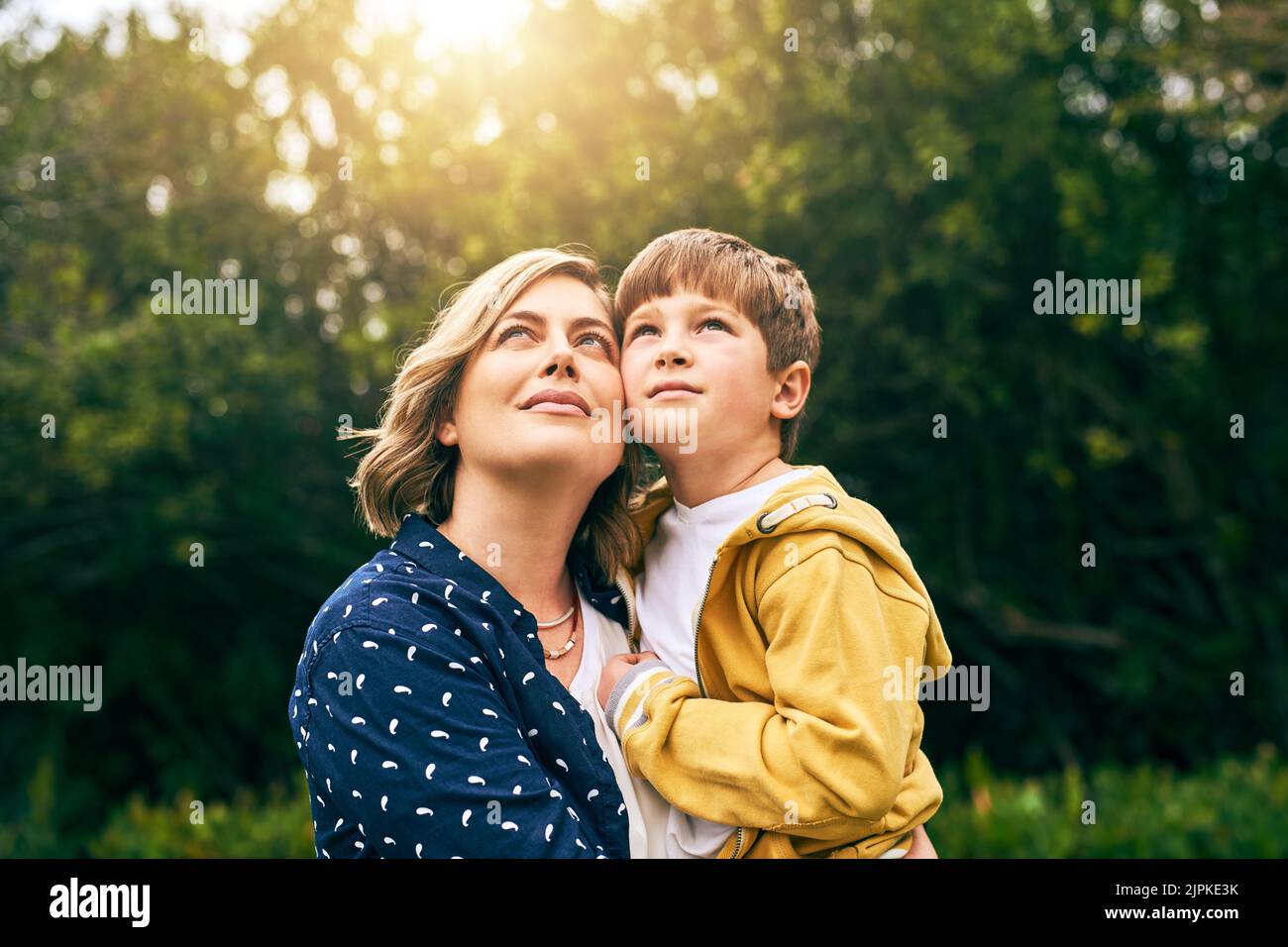 Always look up and wonder my boy. a mother and her son bonding outside ...