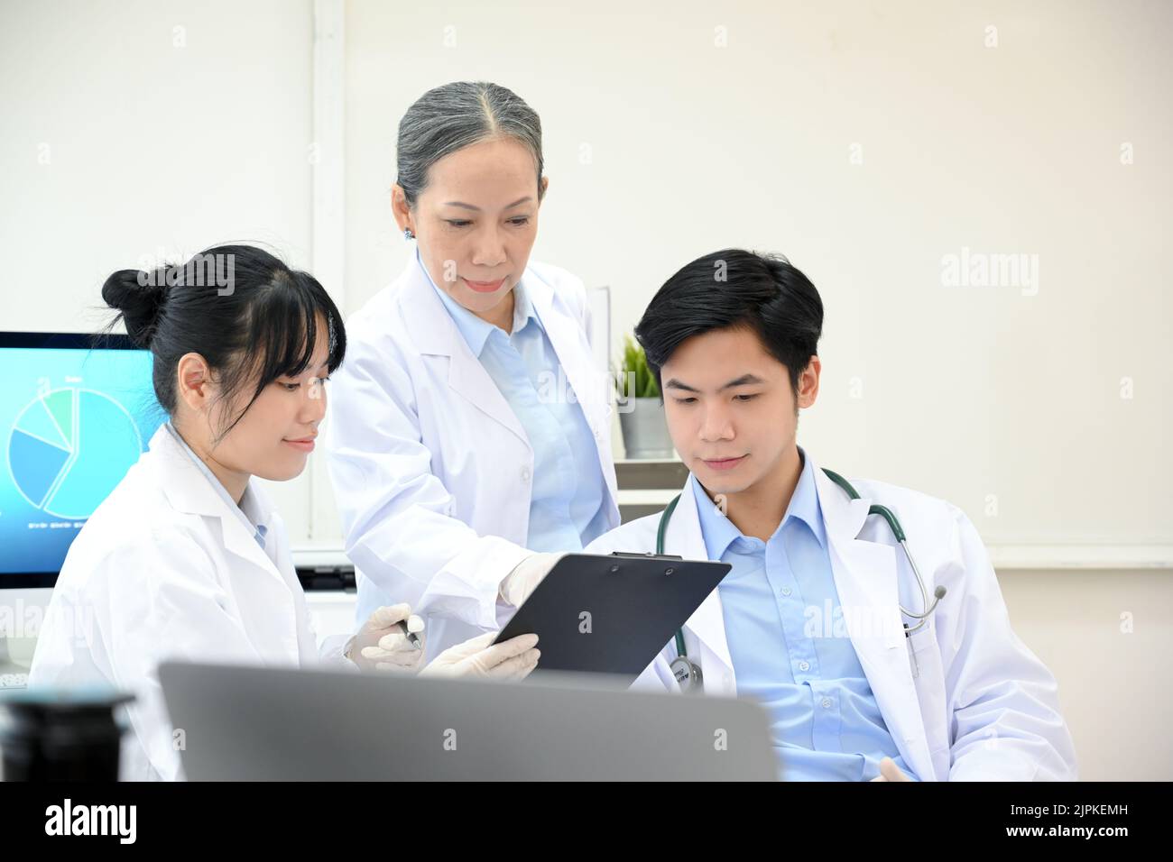 A professional Asian-aged female doctor specialist is giving advice on ...