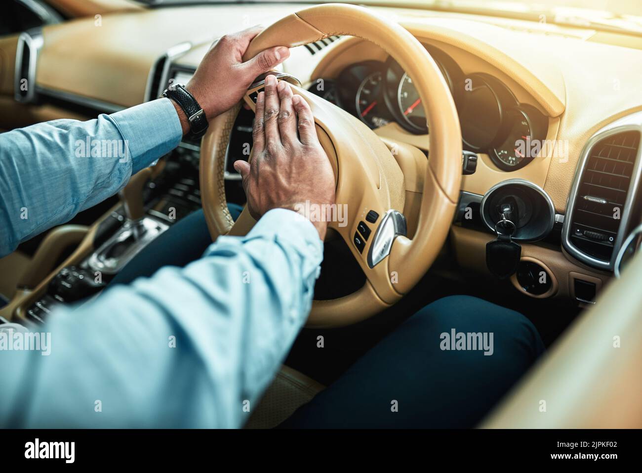 Hes getting impatient with all this traffic. Closeup shot of an ...