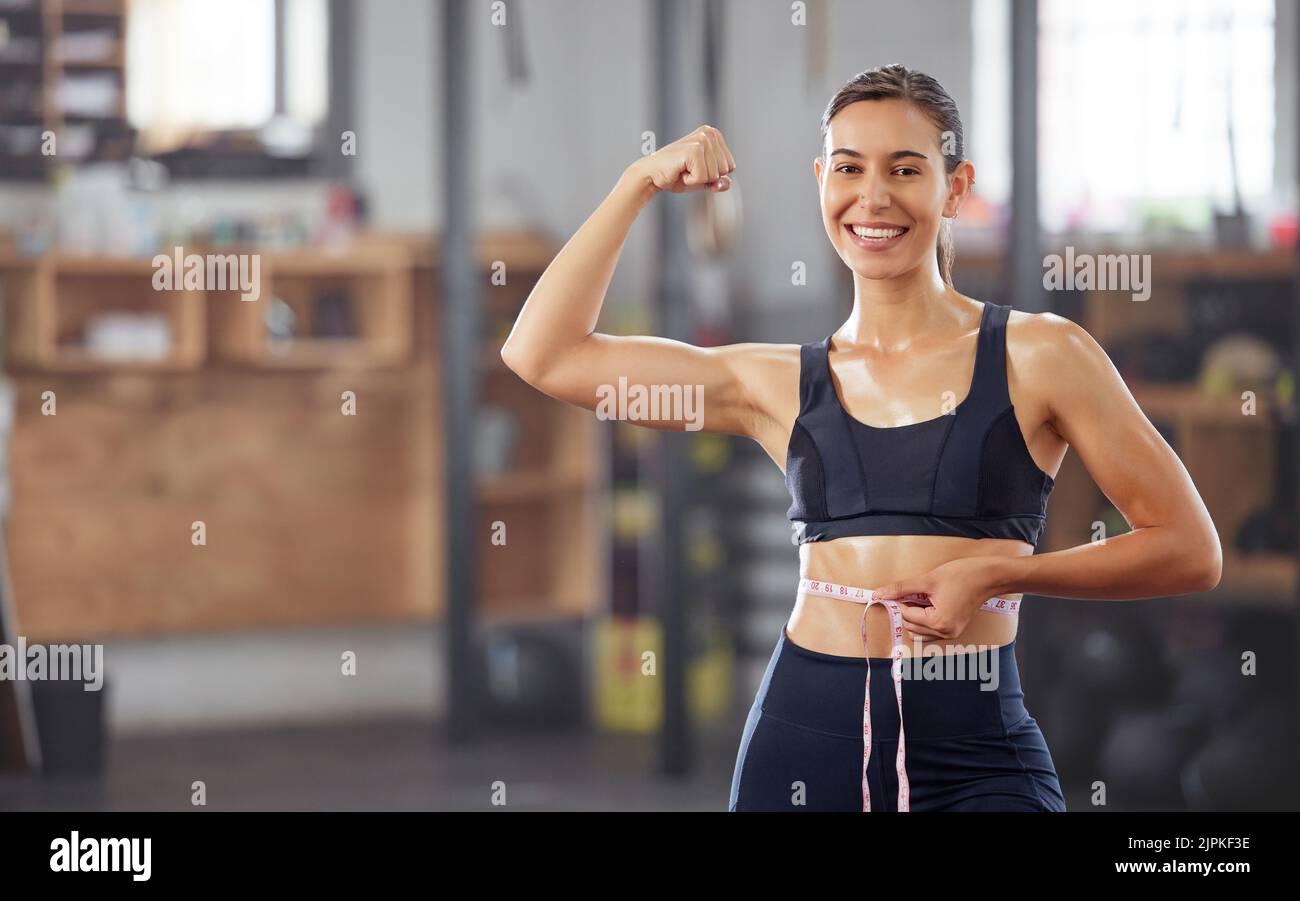 Slim, fit and weightloss with woman holding measuring tape around waist ...