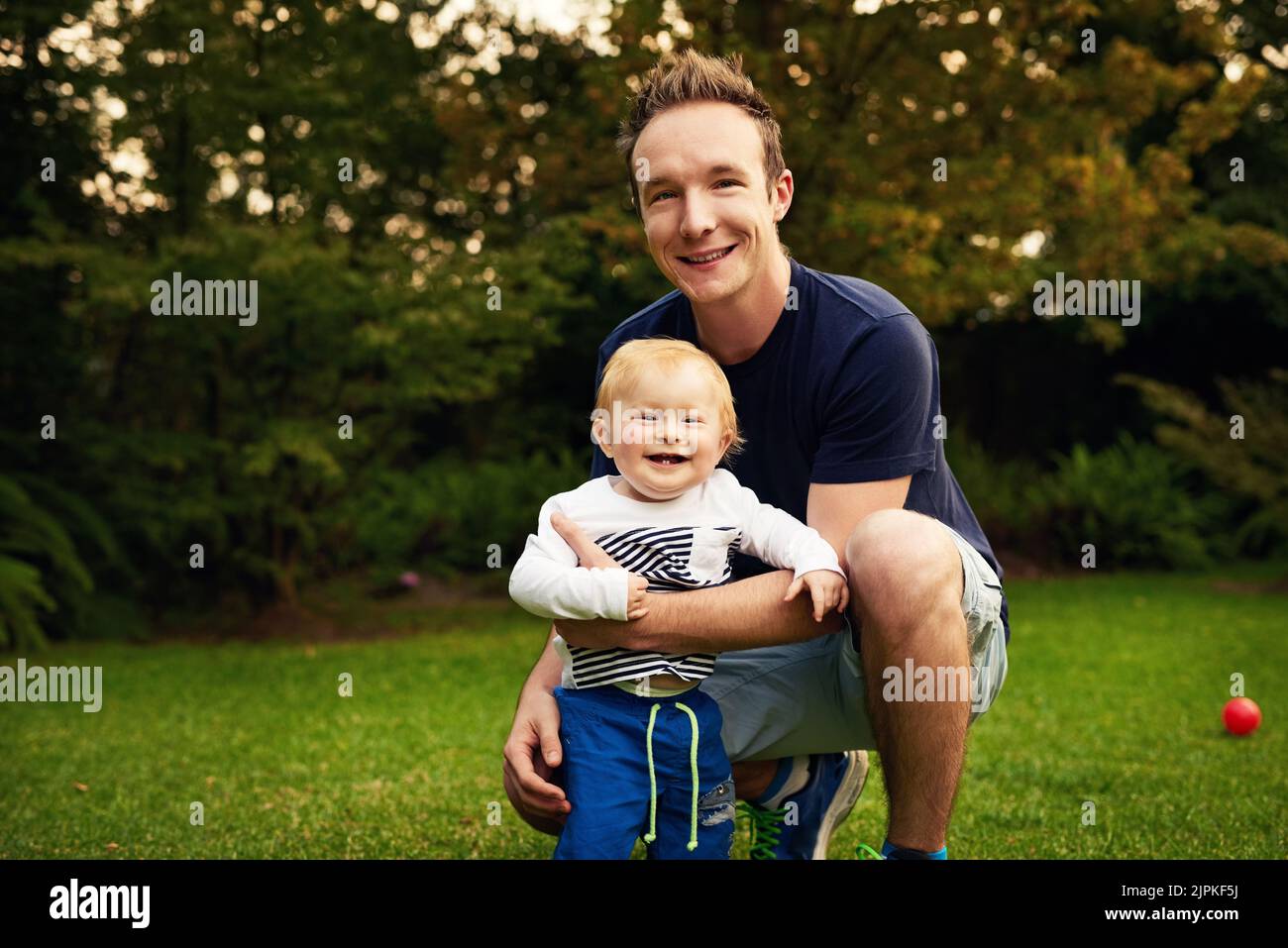 Daddy dearest. an adorable little boy and his father playing in the ...