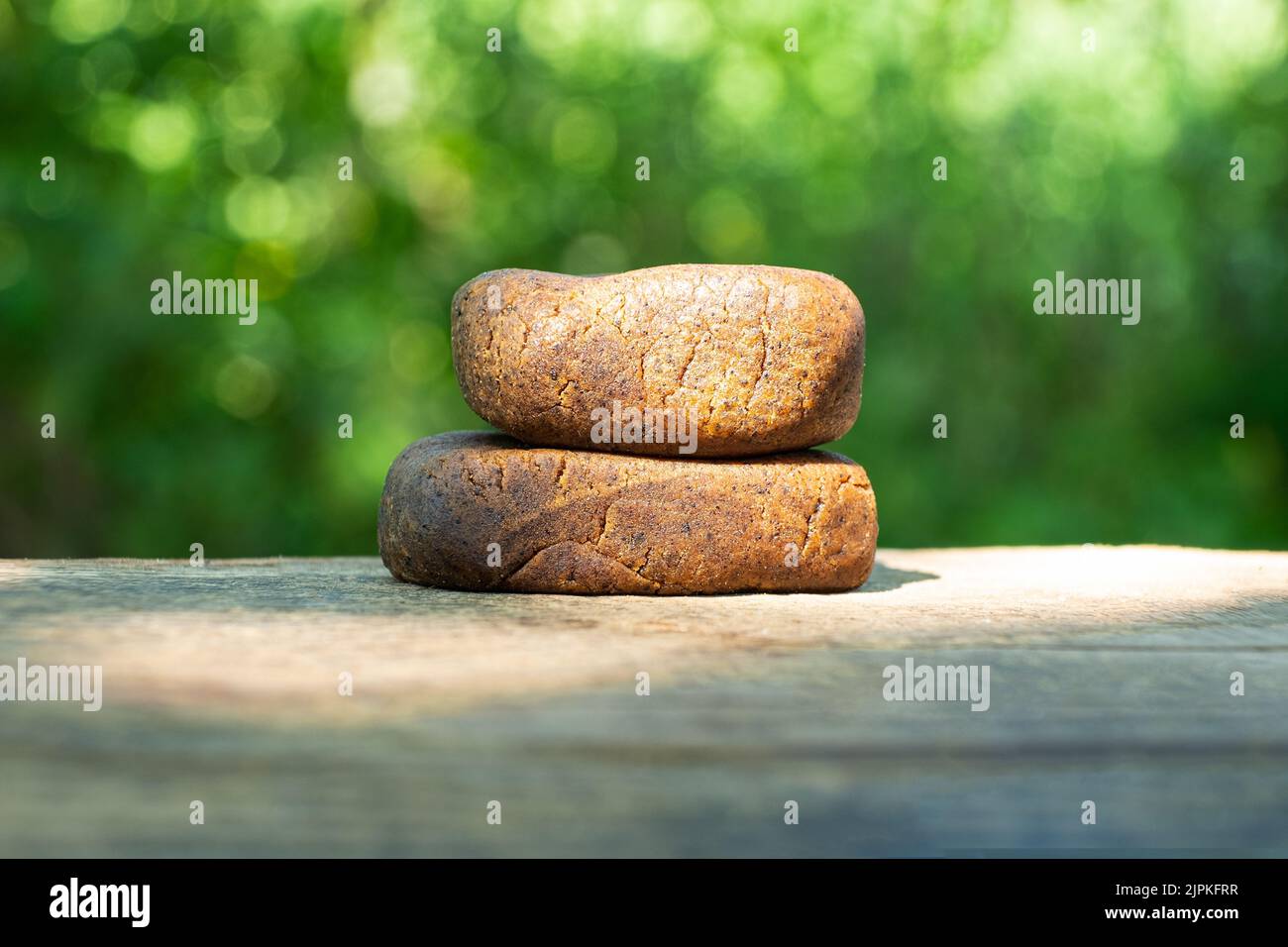 pieces of cannabis hashish with high thc closeup on nature green ...