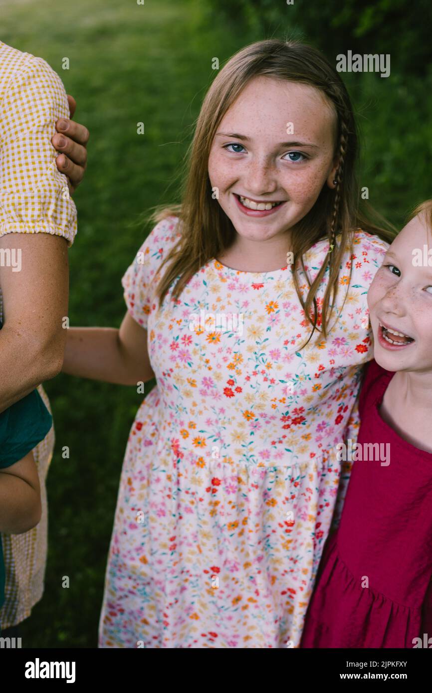 Sisters laugh and hug together and are a happy family Stock Photo - Alamy