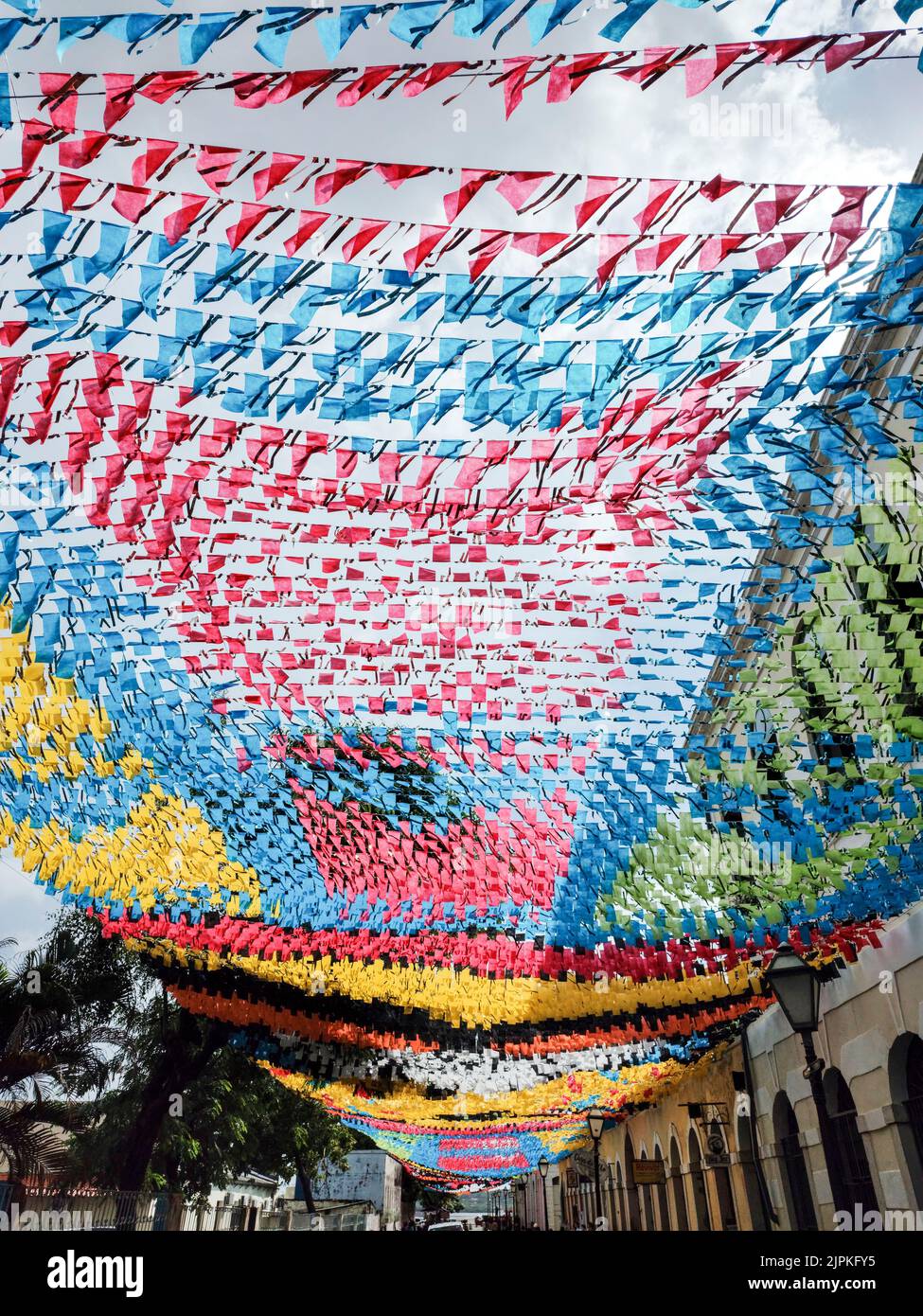 Beautiful view to colorful traditional flags over historic downtown ...