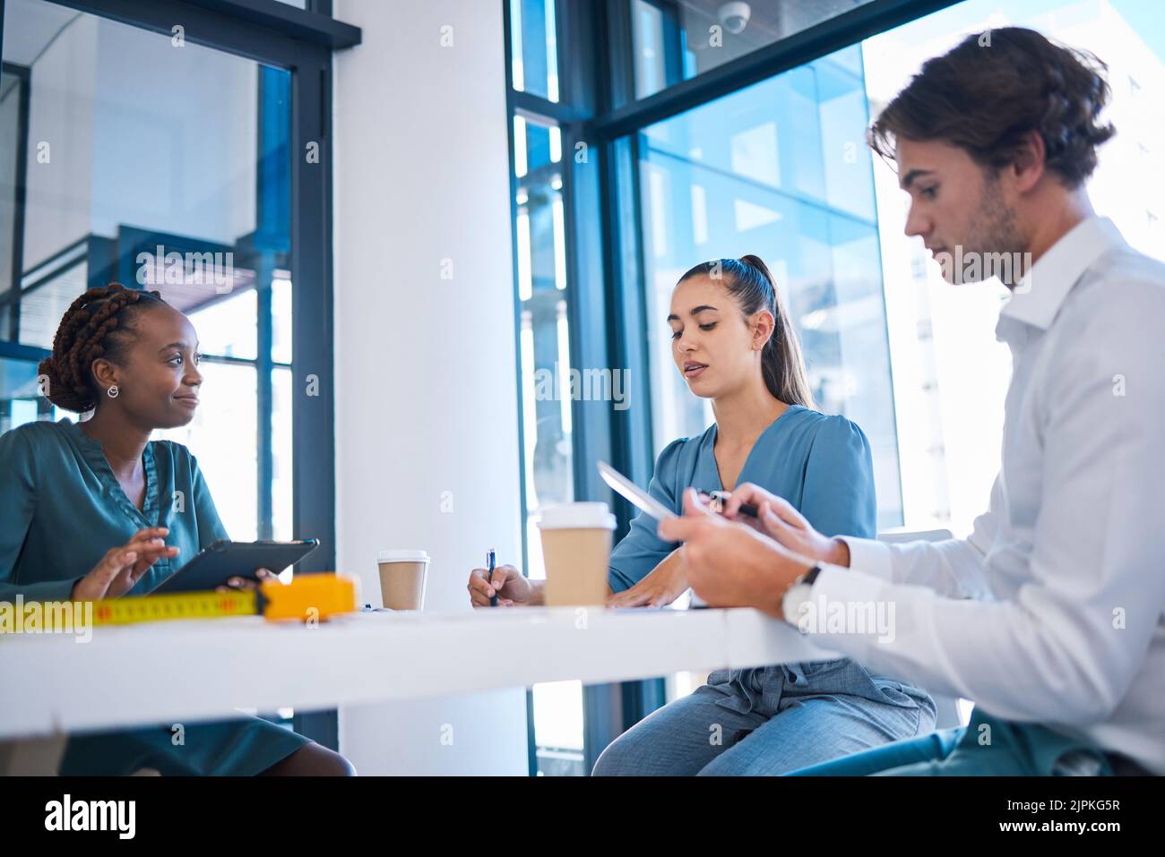 Architects, building engineers or designers with tablet talking ...