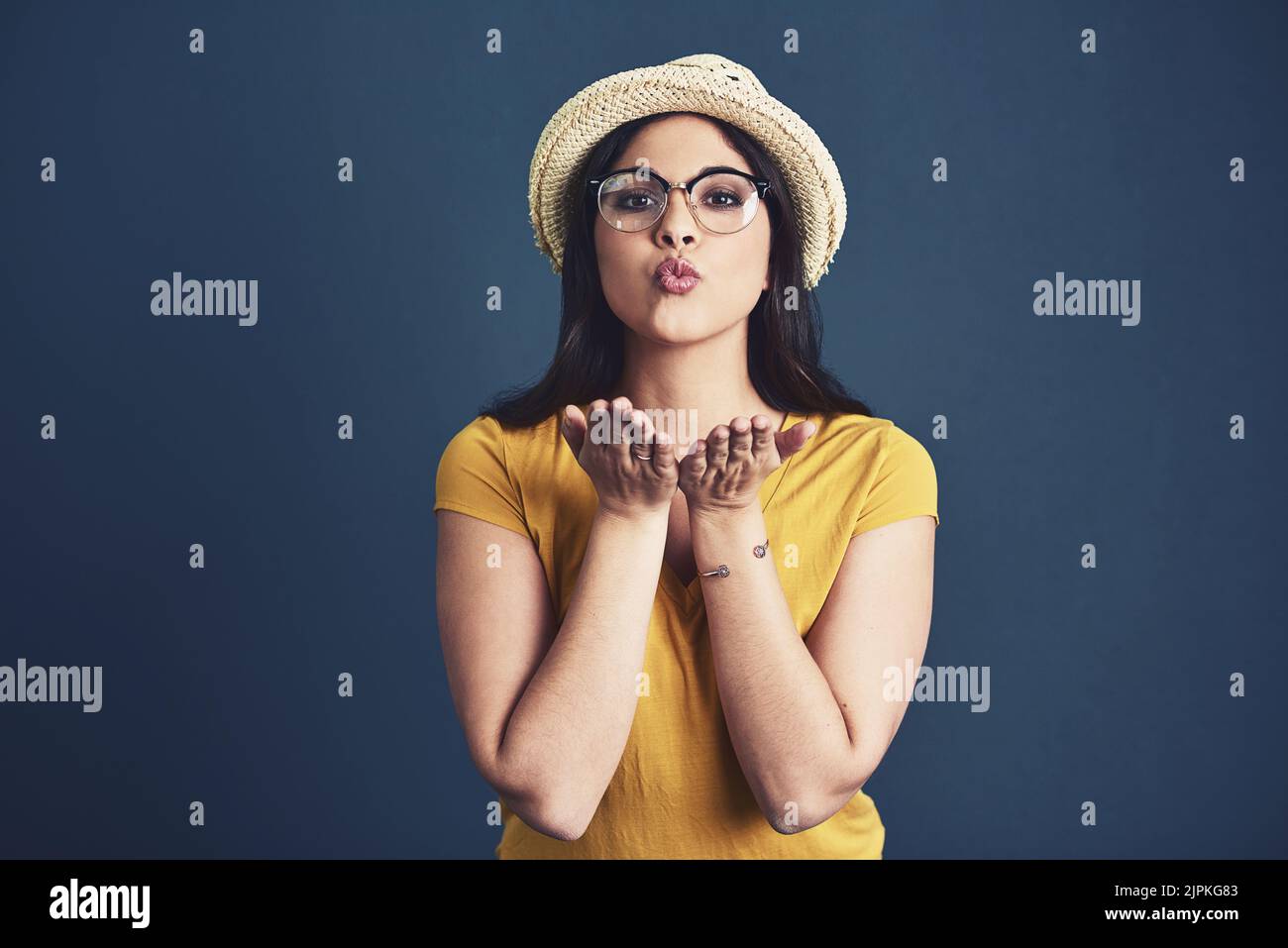 Catch them quickly. Studio portrait of an attractive young woman ...