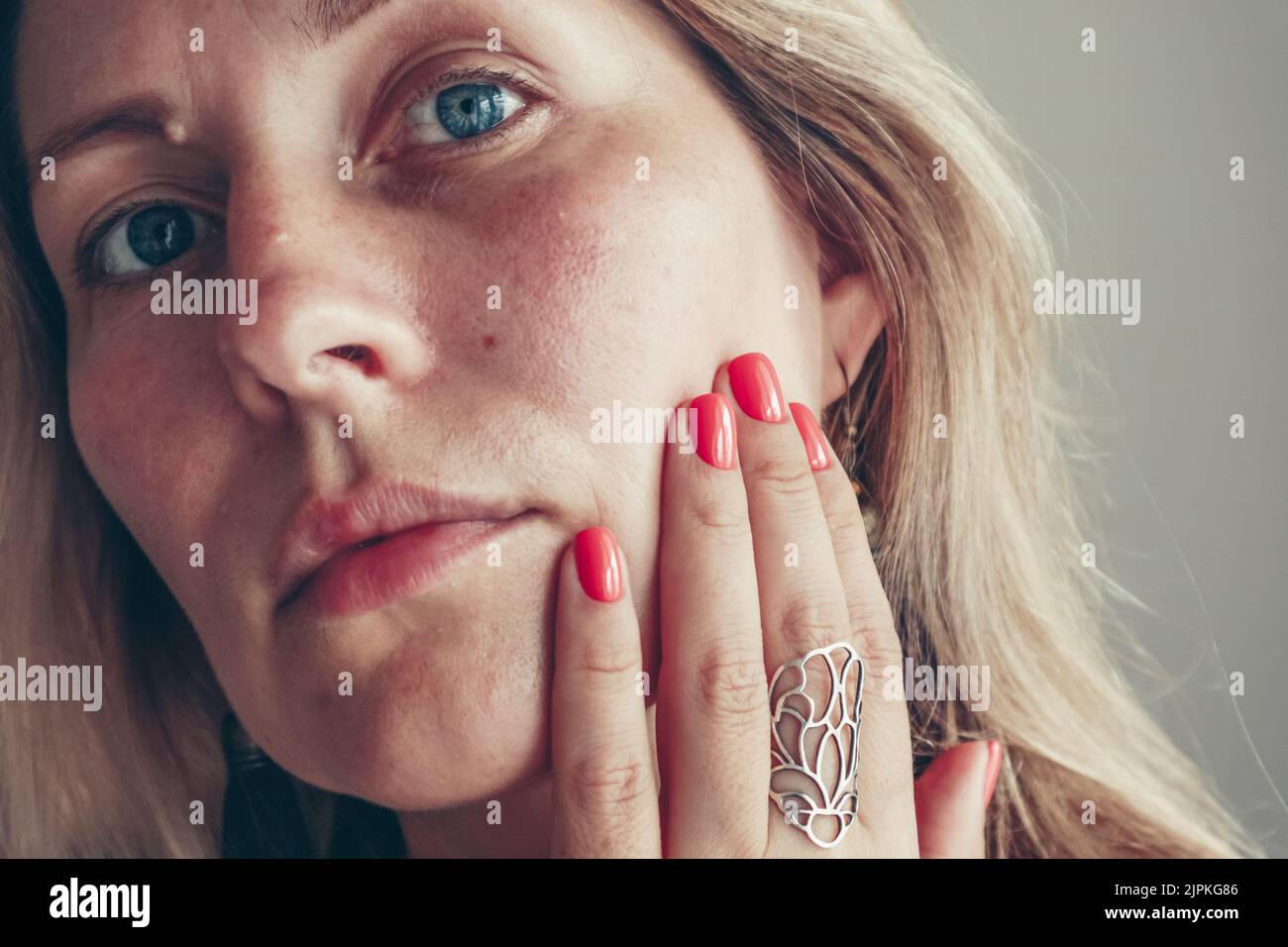 Mature woman red nails hi-res stock photography and images - Alamy