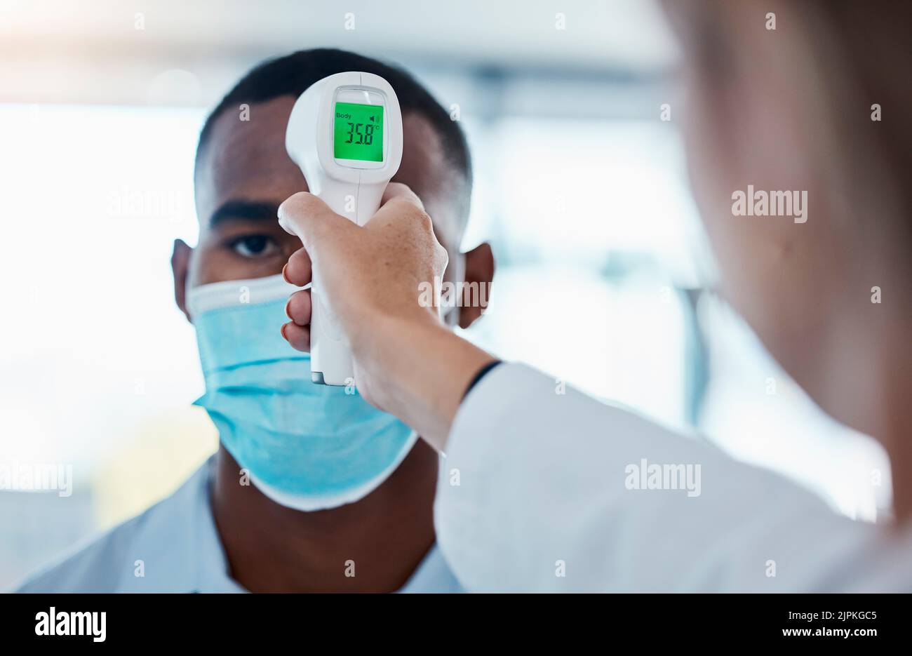 Temperature, thermometer and covid routine before entering office ...