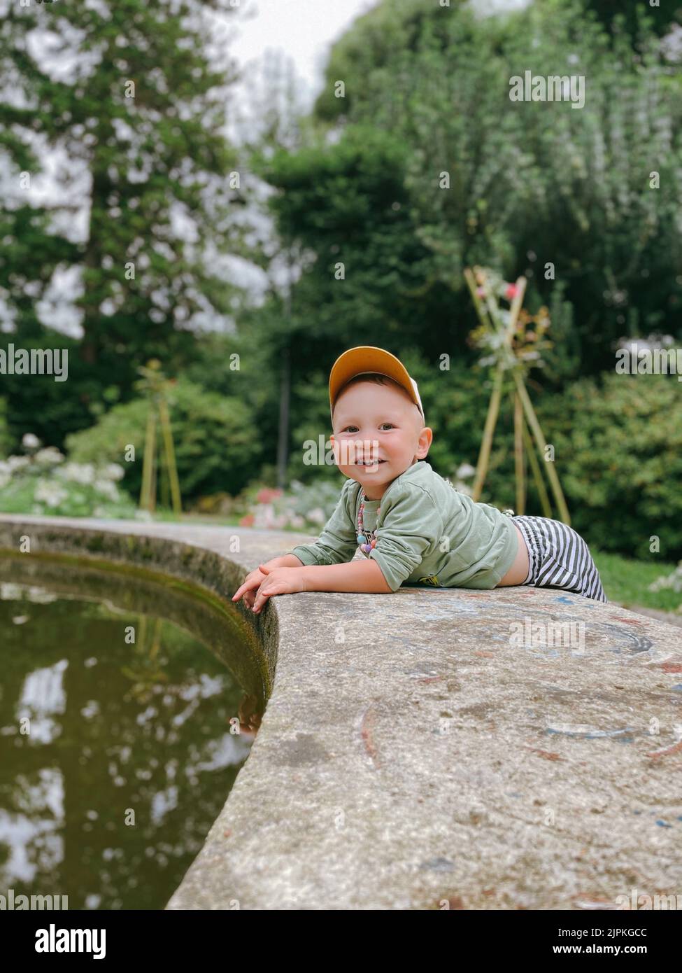 Baby boy near pond hi-res stock photography and images - Alamy