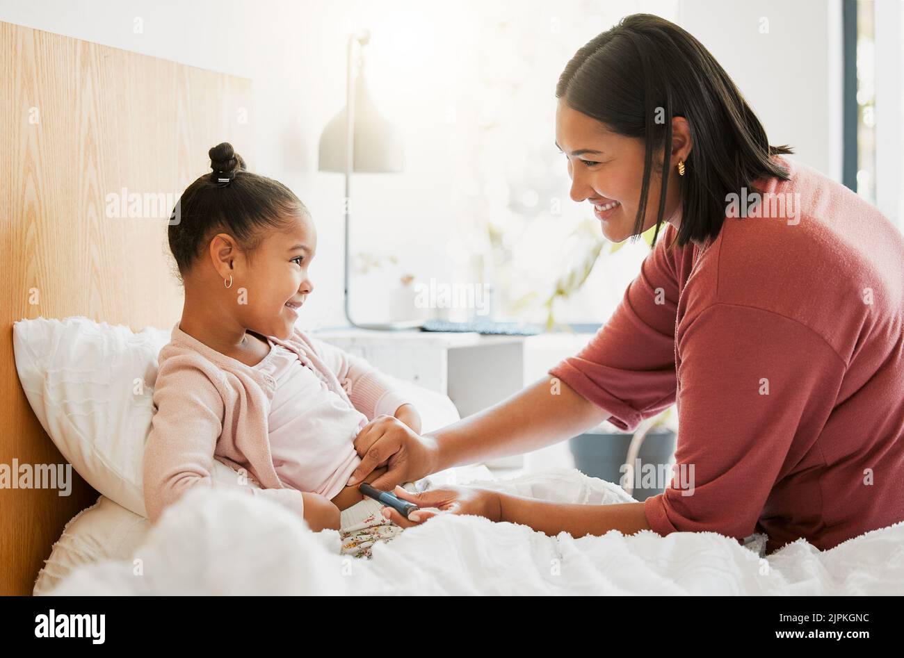 Diabetes, insulin and diabetic happy girl getting injected by her mom ...