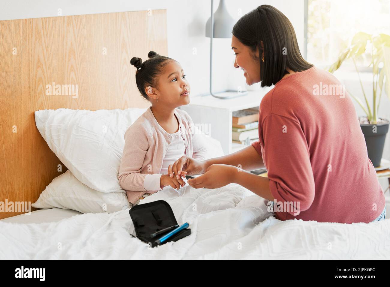 Care, health and diabetic girl talking and bonding with mother ...