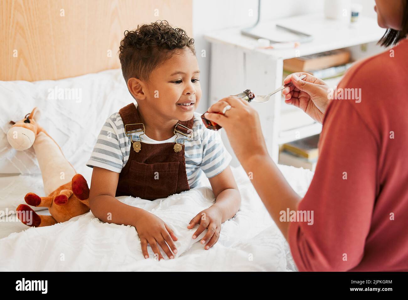 Sick child taking medicine, syrup and treatment for recovery of cold ...