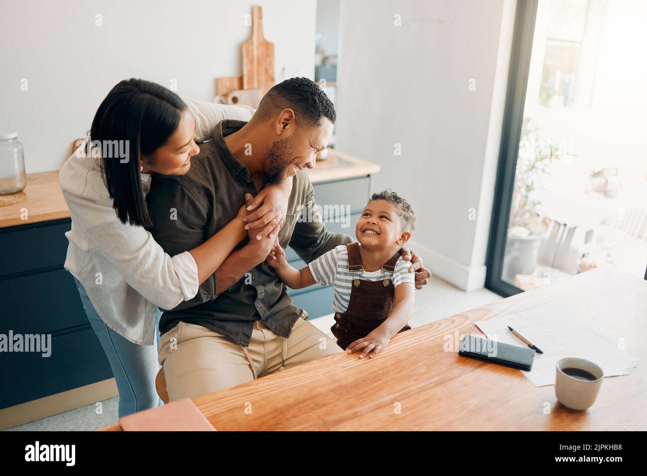 Family fun with playful, funny and happy child with a laughing parents ...