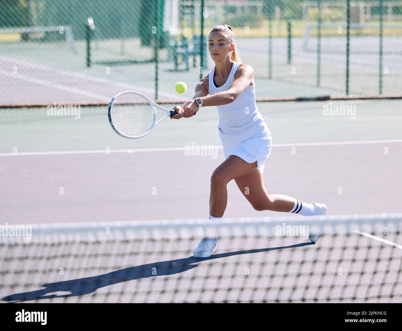 Active, fit and sporty athletic tennis player playing a friendly match ...