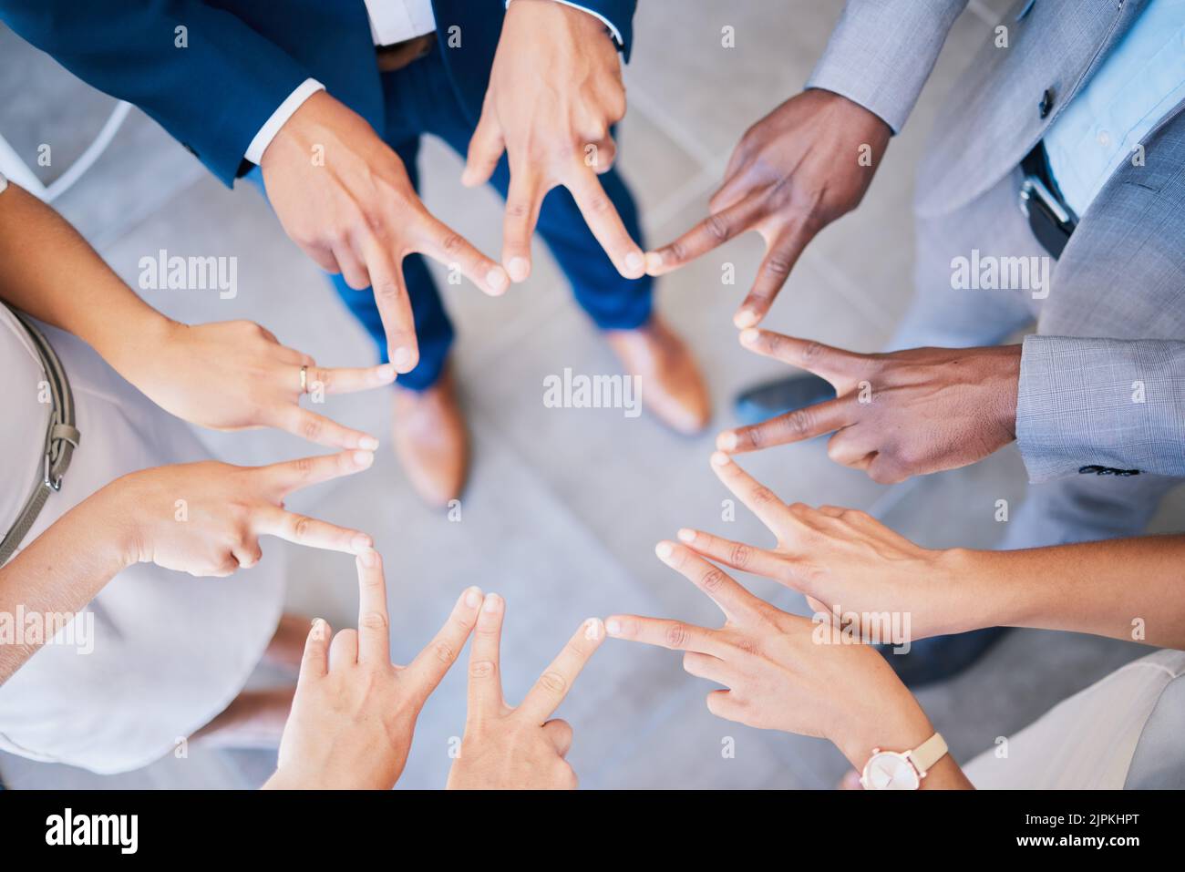 Group of colleagues peace sign hands together for victory, success and ...