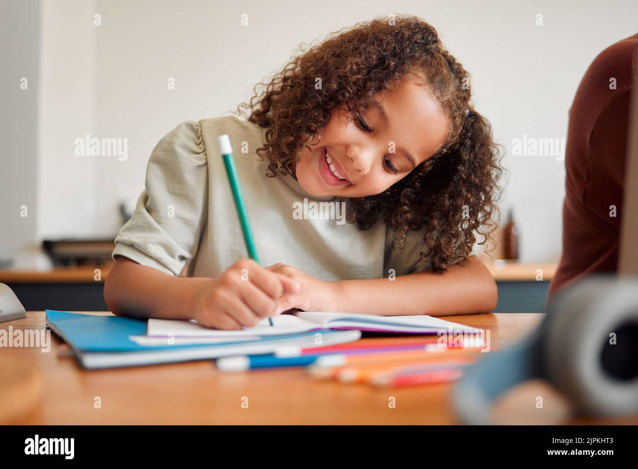 Learning, smiling and creative young girl drawing with a colorful ...