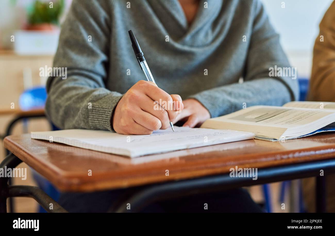 Hes always taking notes. an unrecognizable male university student ...