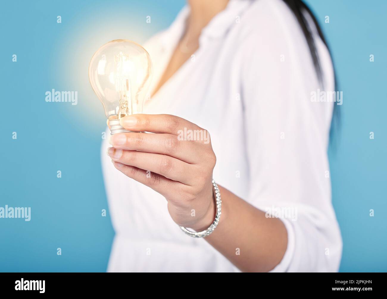 Lightbulb moment, idea and creativity with a light in the hand of a ...