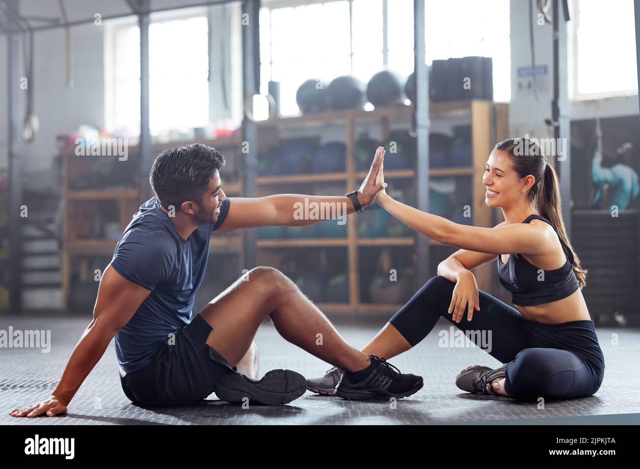 Gym wellness couple high five for success or good exercise and well ...