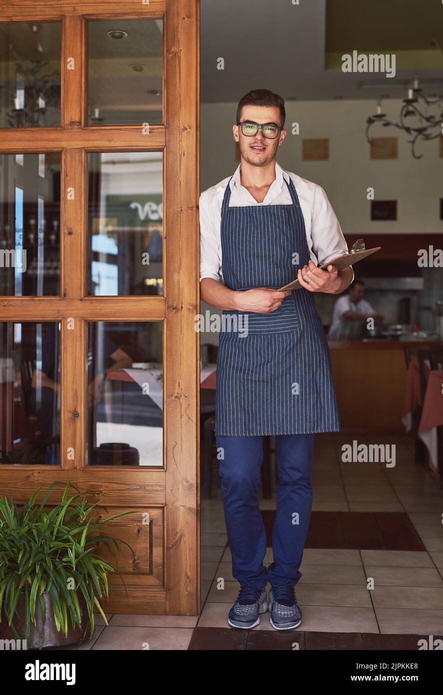 This is the place to be for great food. a man working at a restaurant ...