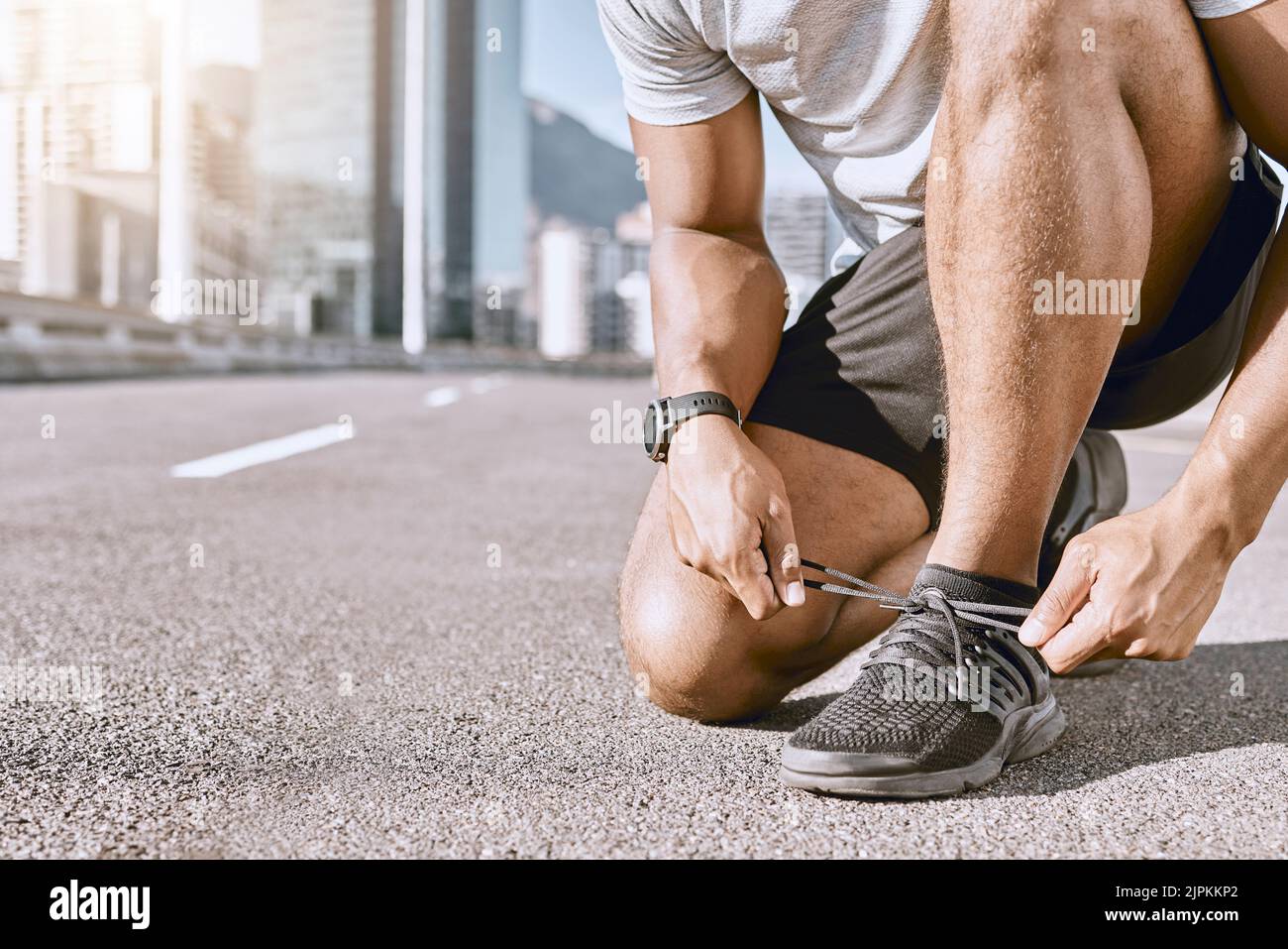 Runner getting ready for fitness running in city street, cardio ...