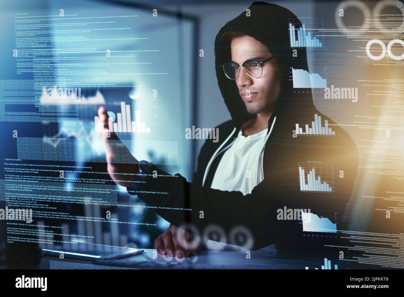 Targeting the next victim. a young hacker cracking a computer code in ...