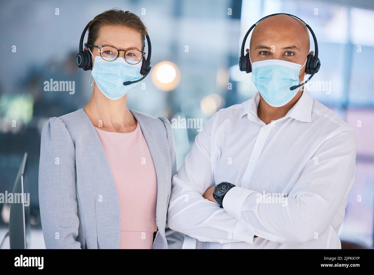Customer service workers, with protection from covid and wearing masks ...